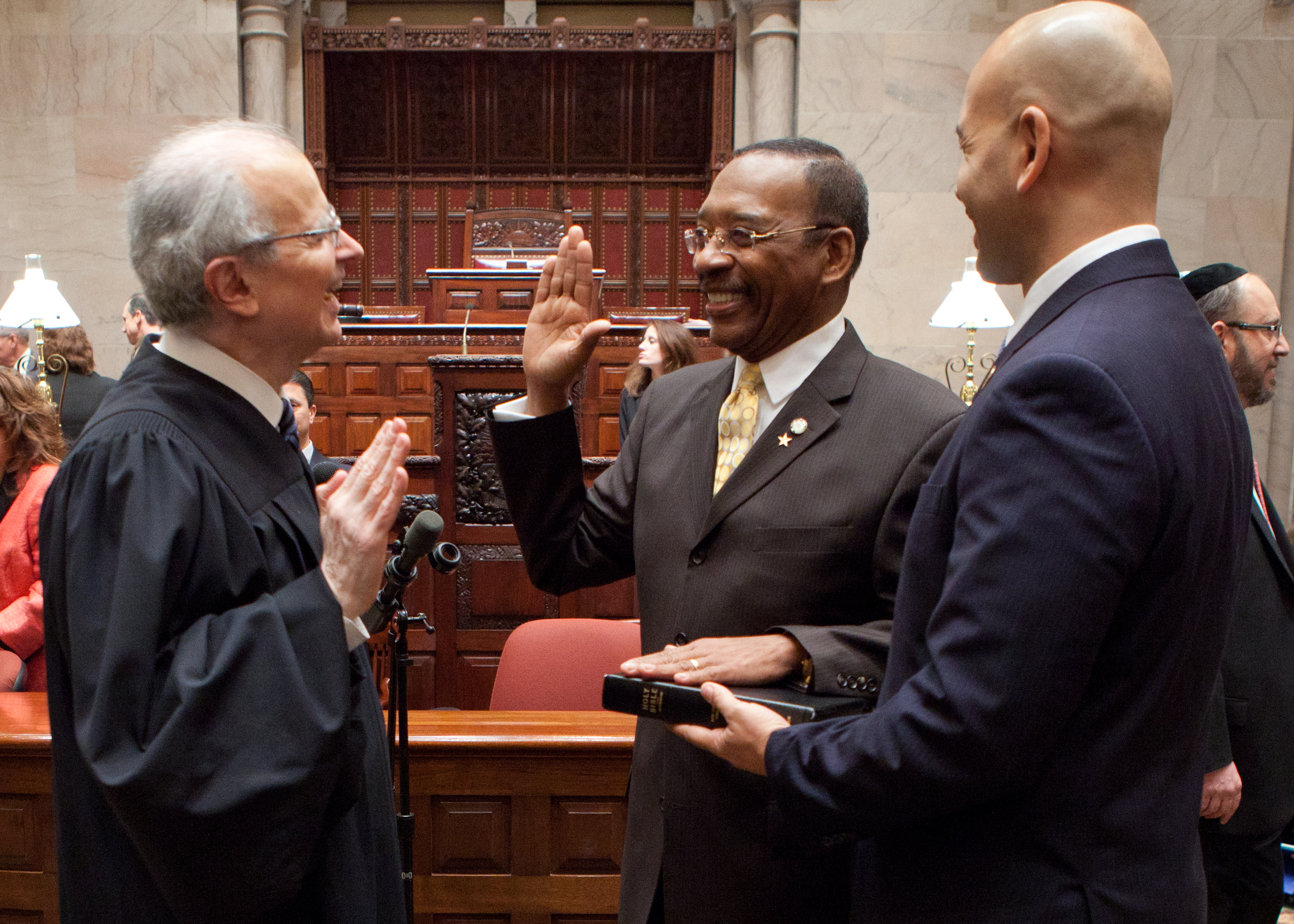 Senator Rubén Díaz (c) is sworn into office by Judge Jonathan Lippman ...