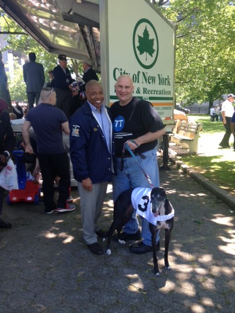 Senator Adams enjoys a light moment with a retired race dog and his ...