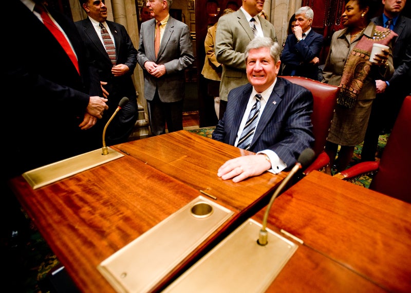 Senator McDonald seated at his desk on his first day as State Senator ...